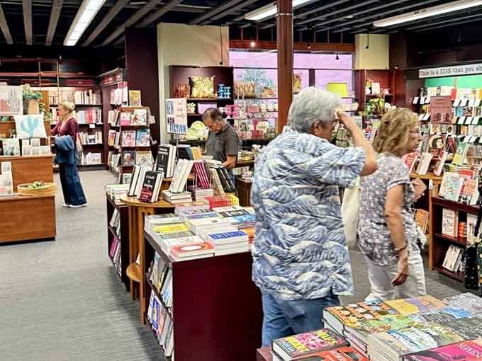 Fellow bibliophiles browse thoughtfully, each on their own quest for that perfect next read.