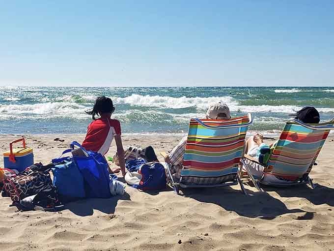 Beach chairs lined up facing the waves, the universal symbol of people who've figured out life's priorities.