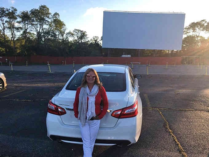 Standing before the big screen, ready to trade your living room couch for automotive luxury and starlight.