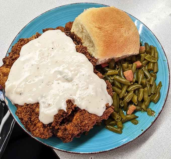 Chicken fried steak smothered in cream gravy, the kind of Texas comfort that makes everything else seem trivial.