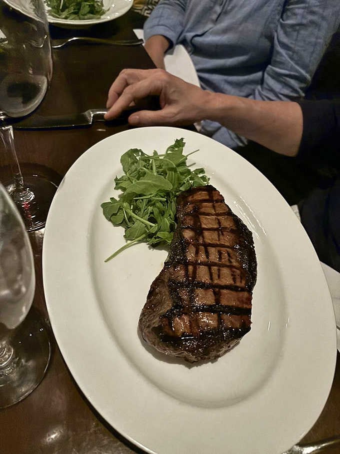 That crosshatch sear on a New York strip is the hallmark of a kitchen that knows steaks.