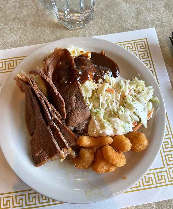 Tender roast beef draped in gravy alongside creamy coleslaw and tater tots is basically a hug on a plate with silverware.