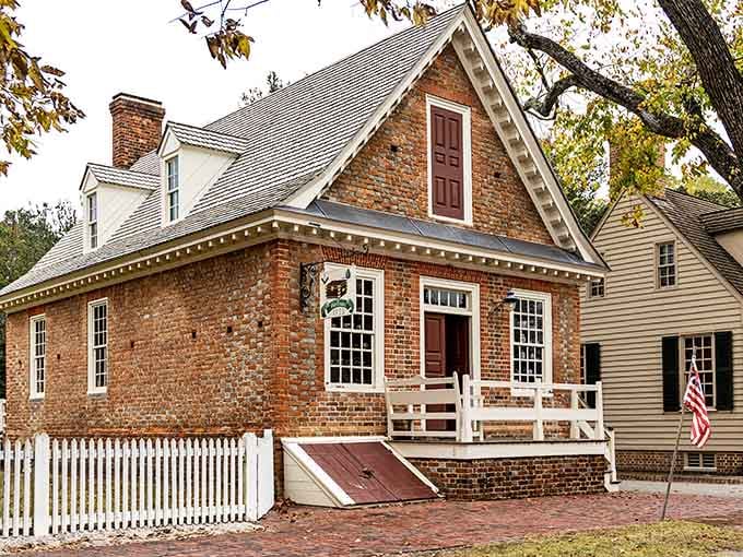 That brick craftsmanship and white porch railing combination hits differently when you realize it's been standing since colonial times.