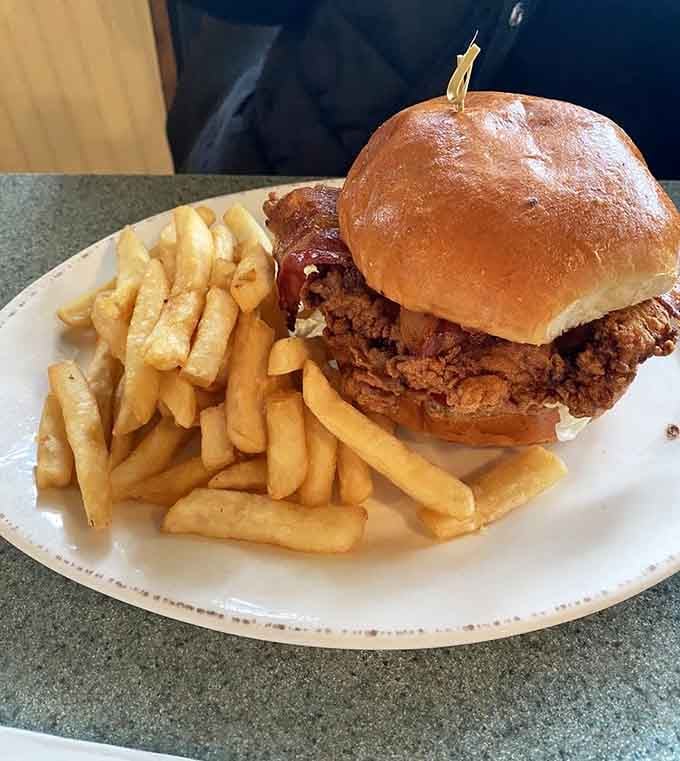 That chicken sandwich isn't messing around, stacked high and ready to make your taste buds write poetry.