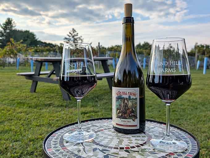 That mosaic table and dramatic sky turn an evening bottle into the kind of moment Hallmark movies are made of.