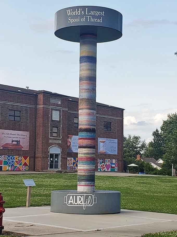 Against a moody sky, this giant spool looks almost majestic, like the Eiffel Tower of the sewing world.