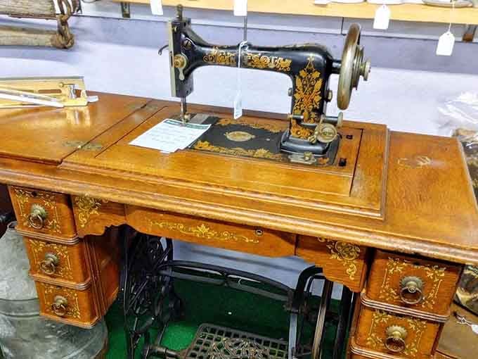 This ornate sewing machine once stitched Sunday dresses and wedding gowns with precision and pride.