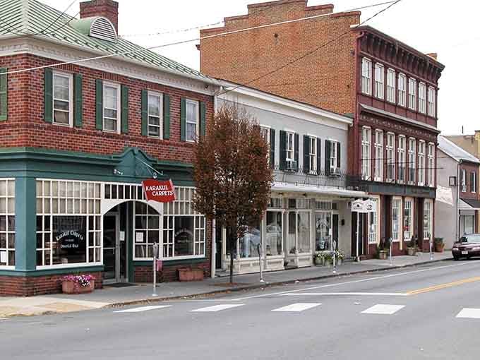 Classic storefronts with green awnings and flower boxes prove that small-town charm never goes out of style, especially at lunchtime.