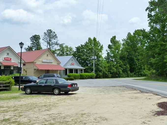 This quiet crossroads captures small-town life where the pace is gentle and the Coca-Cola sign feels comfortingly familiar.