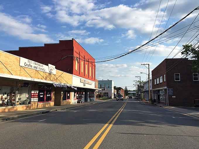 Colorful buildings under dramatic clouds prove small-town charm doesn't need to be boring or stuck in time.