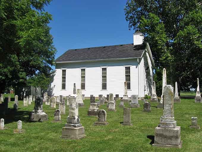 This simple white church and peaceful cemetery remind us that some places honor their history with quiet dignity.