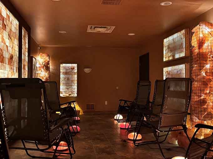 Multiple glowing salt panels transform this space into something that looks straight out of a luxury spa magazine.
