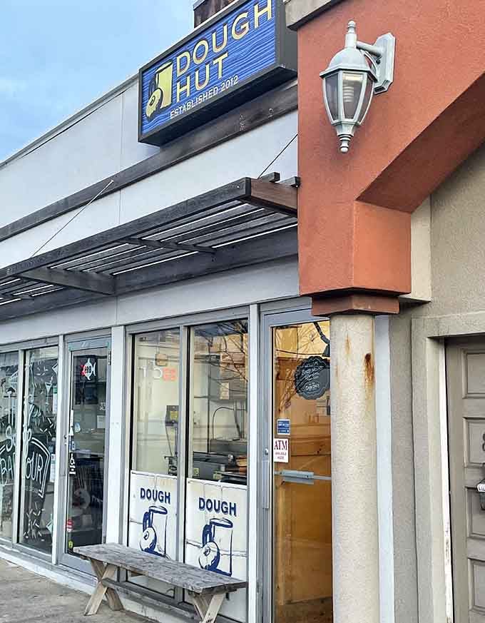 The simple storefront with blue signage keeps things refreshingly straightforward, just like their delicious donuts should be.