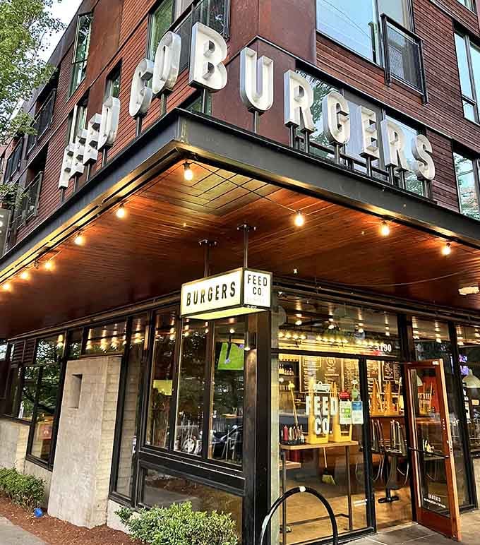 The vintage marquee lettering and warm lights create an inviting urban burger sanctuary worth seeking out in the city.