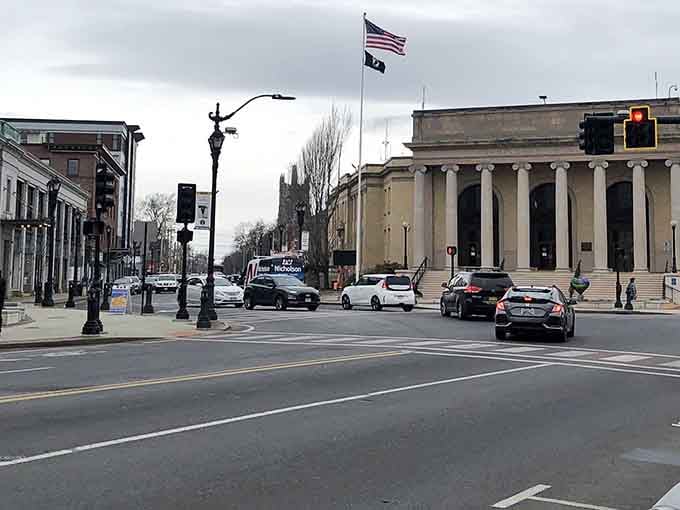 Historic buildings wear their age proudly along streets where parking spots outnumber the stress of finding them.
