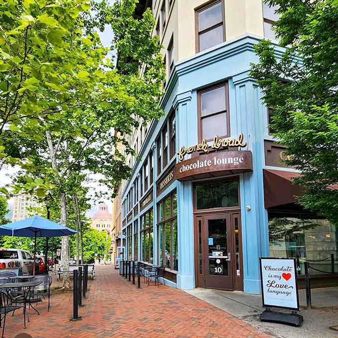 That turquoise corner storefront practically sings "come inside for chocolate" louder than any Broadway marquee ever could.