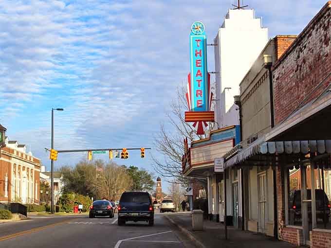 That vintage theater marquee glows like a ruby against the sky, promising entertainment the old-fashioned way with character.