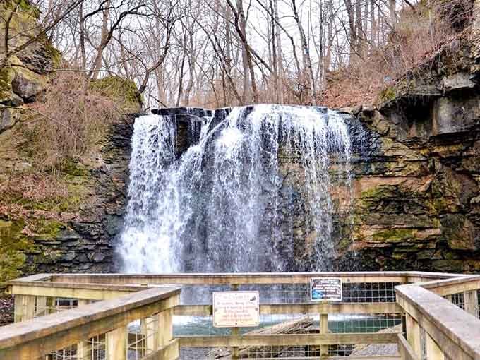 Limestone cliffs cradle this suburban oasis where cool mist rises like nature's own air conditioning system.