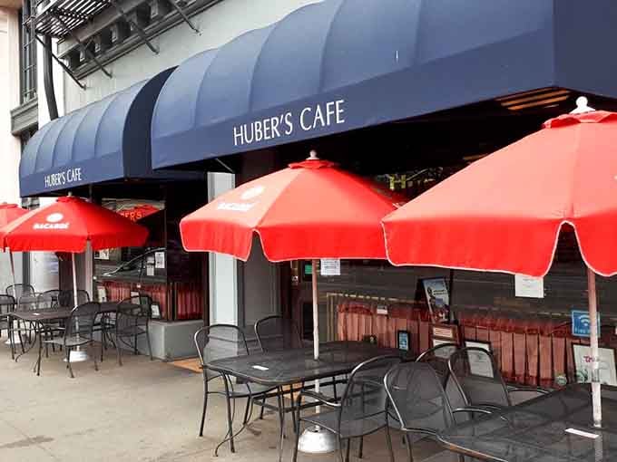 Sidewalk seating under bright umbrellas turns an ordinary lunch into a delightful people-watching adventure in the heart of downtown.