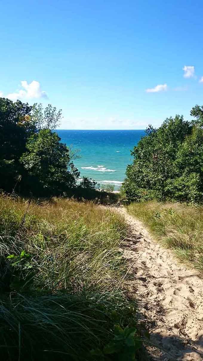 That sandy path through beach grass leads to blue water so perfect, you'll forget you're still in the Midwest.