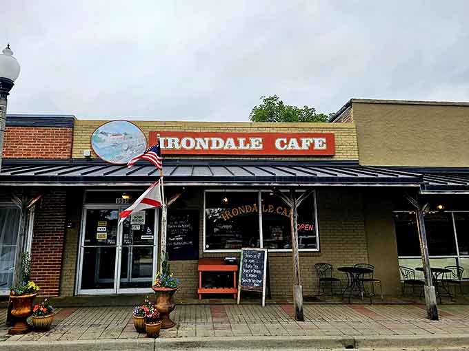 The cheerful signage and patriotic flag welcome you to a place where Southern comfort food meets genuine literary history.