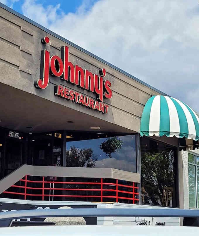 That retro sign and striped awning give off serious "Happy Days" vibes, but the food's even better than nostalgia.