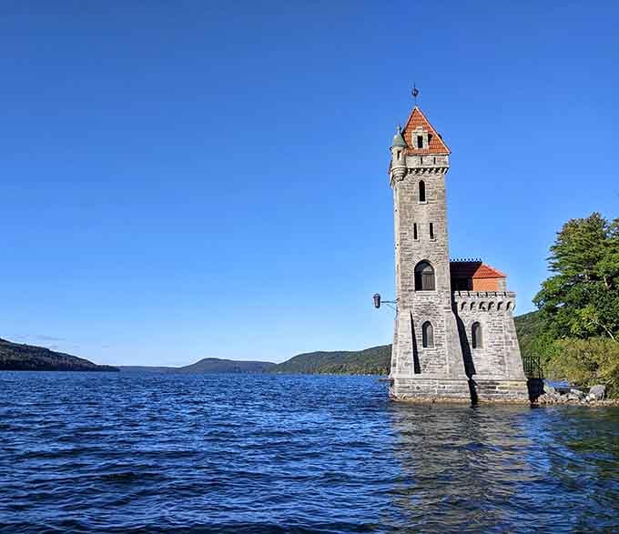 Rising from the lake like a medieval fantasy, this stone tower creates a scene worthy of any storybook.