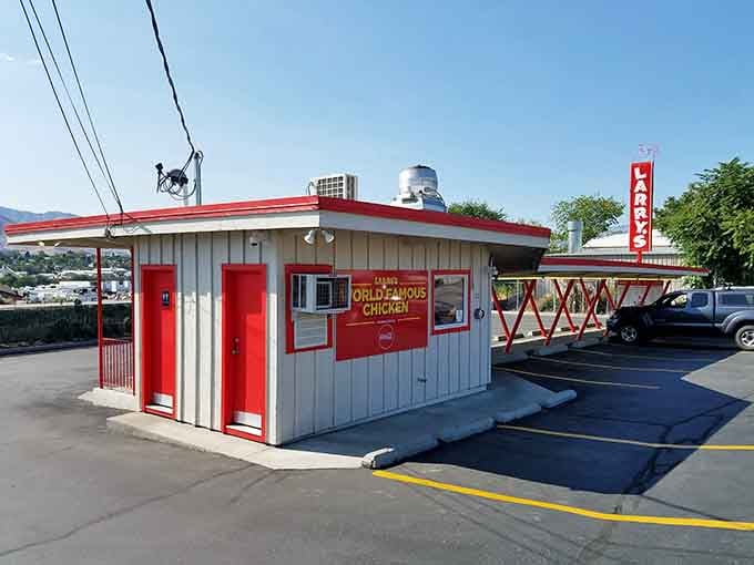 That classic red-and-white drive-in with its retro canopy is like a time machine serving up golden fried goodness.
