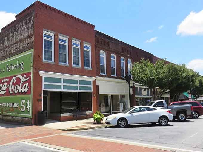 That vintage Coca-Cola sign reminds you when a nickel bought refreshment and Main Street was America's shopping center.