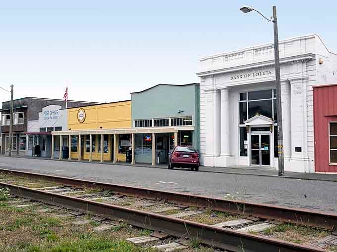 The old Bank of Loleta stands proud among colorful storefronts, a testament to simpler times and stronger community bonds.