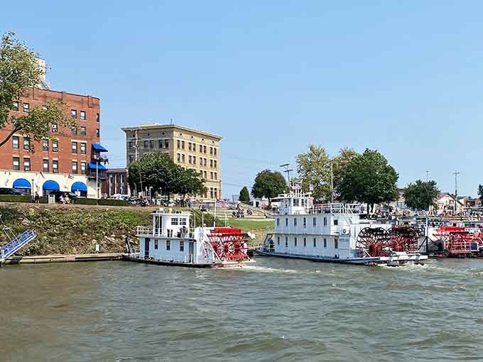 Paddle boats rest along the riverbank where historic buildings watch over the water like proud guardians of time.