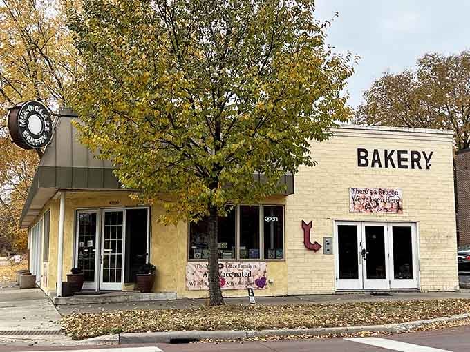 The white brick and autumn leaves create a scene straight from a Norman Rockwell painting of small-town America.