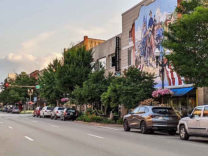 That dramatic mural transforms a building wall into storytelling canvas, proving public art belongs everywhere, not just museums.
