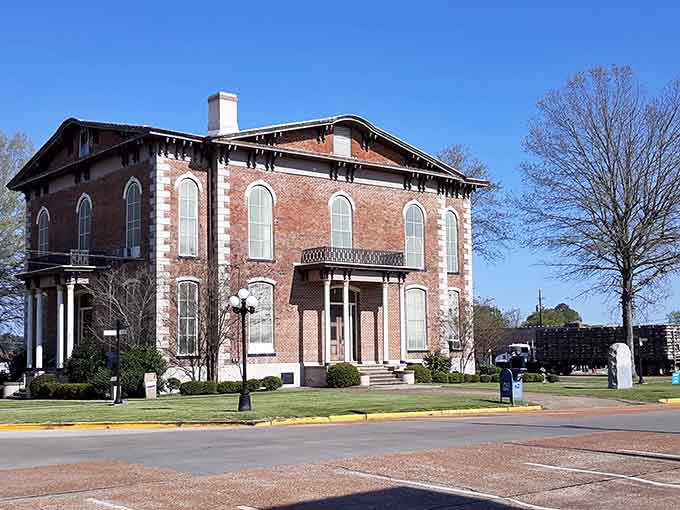 This elegant brick courthouse holds secrets in its windows that have puzzled visitors for over a century.