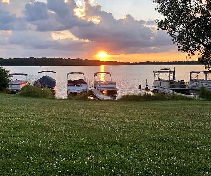 Sunset over the boats creates a postcard moment that'll make your neighbors jealous when you show photos.