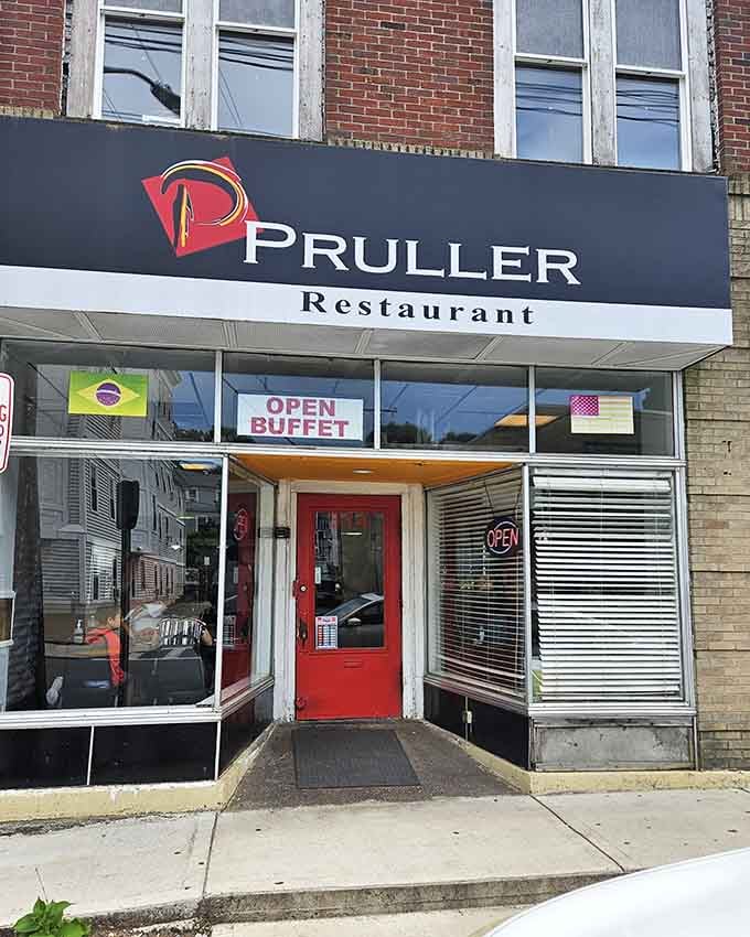 The bold storefront signage and bright red door welcome you into a no-nonsense spot where quality beef takes center stage.