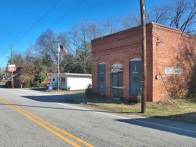 The old brick storefront still flies the flag proudly, a reminder of communities built on hard work and hometown pride.