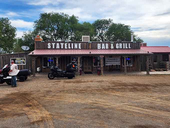 The red metal roof and weathered wood create that perfect Old West vibe you just can't fake anymore.