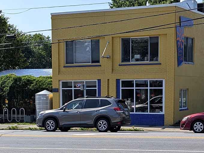 That golden brick exterior and blue tile accents give this breakfast haven a distinctive character that stands out beautifully.