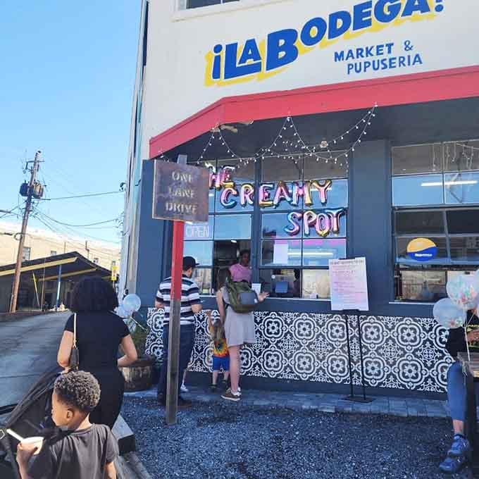 Neon signs glowing against a neighborhood market &ndash; this is where cultures blend into delicious harmony wonderfully.