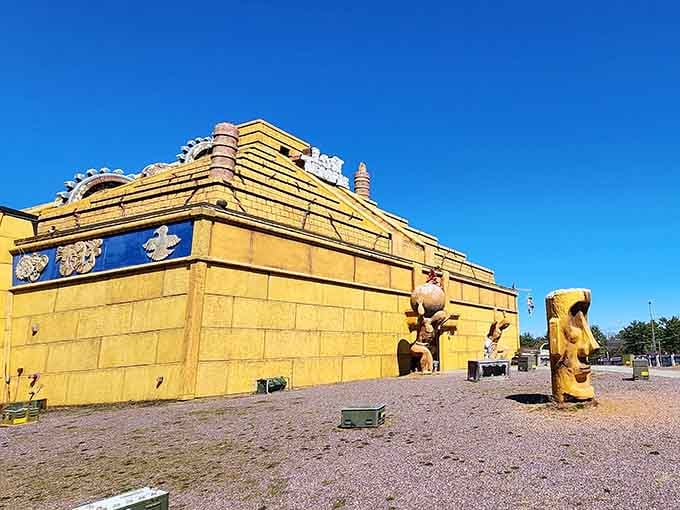 Massive golden blocks and carved guardian statues create an ancient temple that looks plucked from another continent entirely.