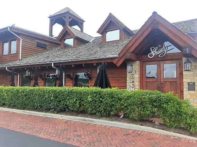 The Shanty's rustic timber architecture evokes cozy cabin vibes, where Friday fish fries become cherished weekly traditions.