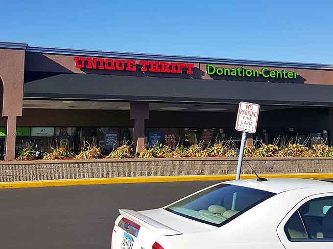 Bold red and green neon signals this donation center where your castoffs help fund community programs while shoppers score deals.