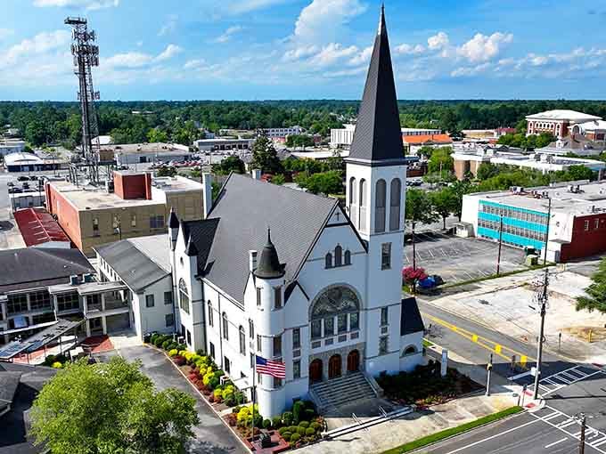 That white church steeple piercing the sky reminds you that some towns were built on faith and railroad schedules.