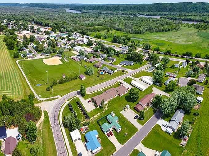 From above, this riverside community spreads out like a patchwork quilt stitched together with tree-lined streets and sparkling water.