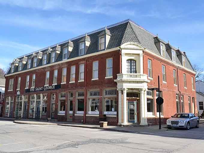 The Saint George Hotel's elegant corner turret and mansard roof whisper tales of travelers from a more gracious era.