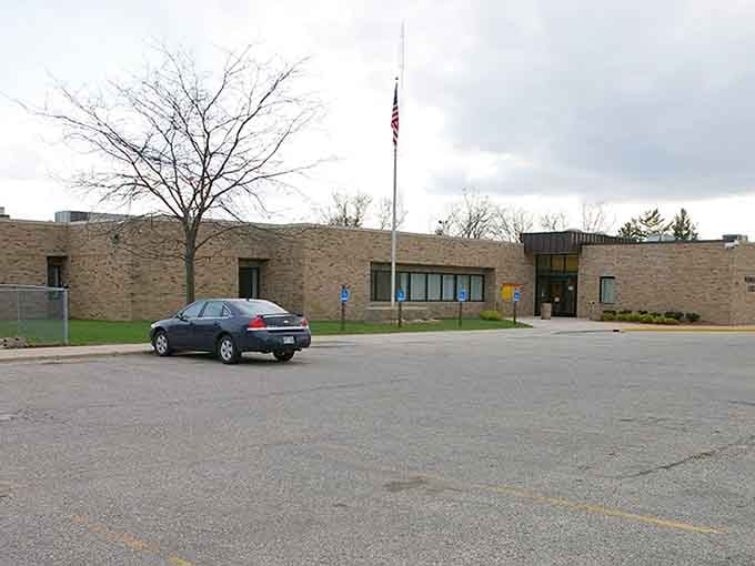 Solid civic architecture stands proud, representing the dependable community services that keep small towns running smoothly and safely.