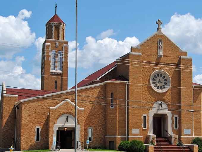 Soaring brick tower and rose window announce a sacred space where craftsmanship and faith built something meant to last generations.