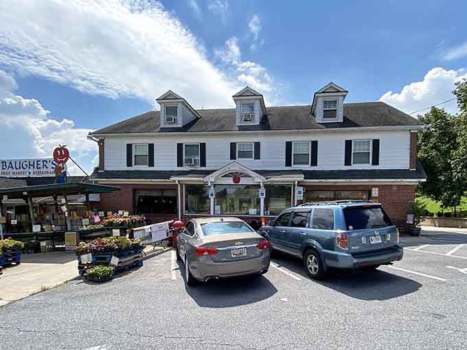 The white colonial facade and bustling parking lot signal that locals know exactly where to eat.