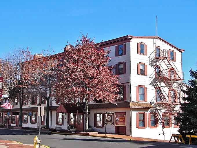 Spring blossoms frame this riverside town where historic charm blooms as reliably as the trees lining these timeless streets.